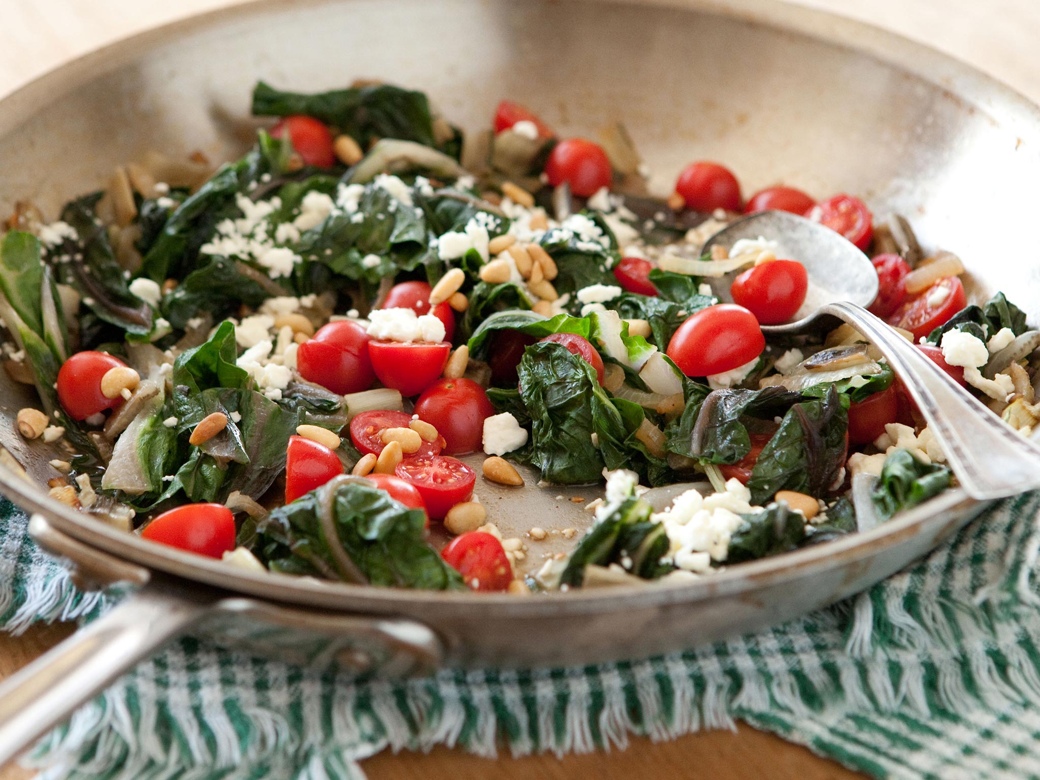 Recipe: Swiss Chard with Tomatoes, Feta and Pine Nuts | Whole Foods Market